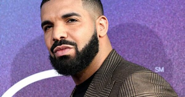 Drake leaves hotel in bulldog mask ahead of 'For All the Dogs' release