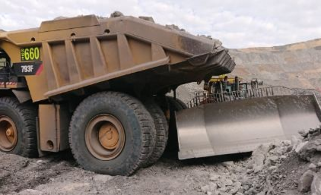 Truck rolls backwards and collides with dozer
