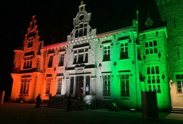 Belgium's iconic building lights up in tri-colour