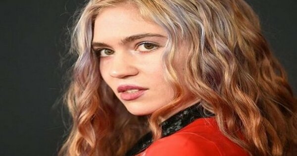 Grimes shares tattoo of 'beautiful alien scars'