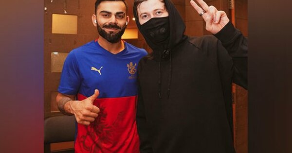 Alan Walker poses with Virat Kohli at RCB Unbox ahead of IPL 2024