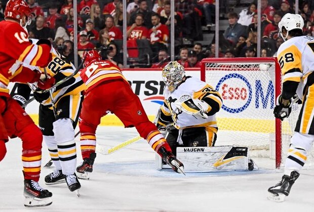 Yegor Sharangovich (2 goals), Flames rally past Penguins
