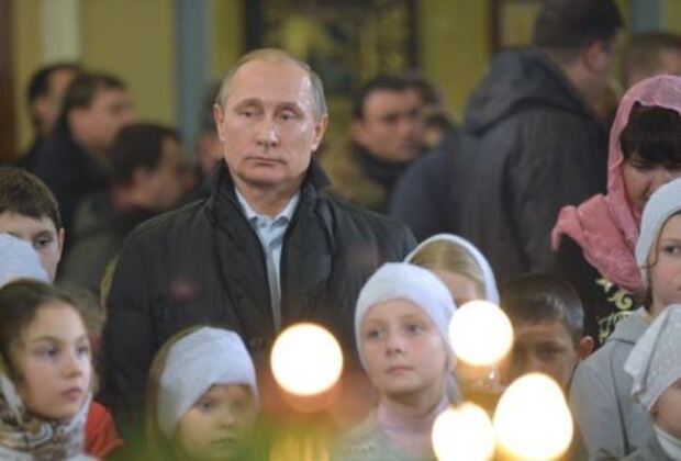 Putin Attends Mass At Rural Church Where Parents Were Baptized