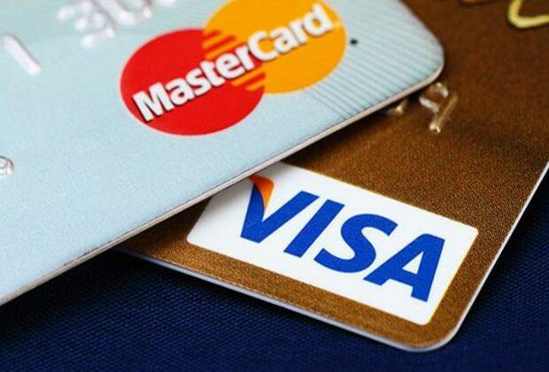 Visa, Mastercard settle suit with merchants on swiping fees