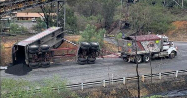 Tipper truck tips over