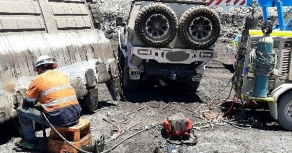 Runaway light vehicle gives tradesman a close shave