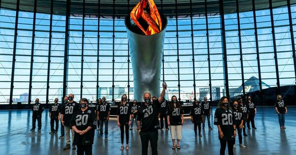 Frontline medical workers light Al Davis Memorial Torch