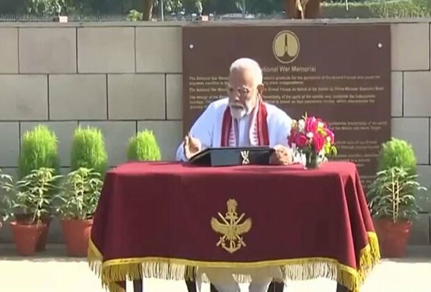 PM-elect Narendra Modi signs visitor's book after laying wreath at the ...