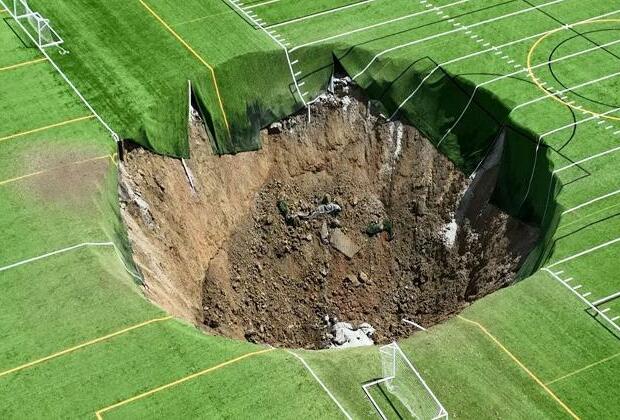 Center of soccer field built atop limestone mine sinks in Illinois