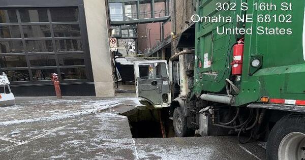 Downtown Omaha loses power after garbage truck gets stuck in sinkhole