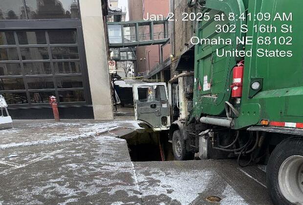 Downtown Omaha loses power after garbage truck gets stuck in sinkhole